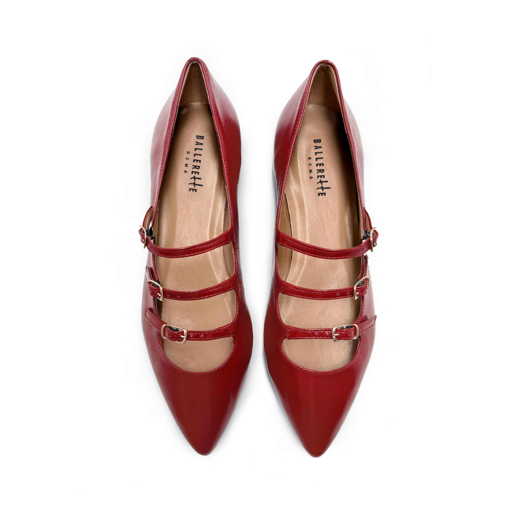 Red shiny pointed-toe ballet flats with straps